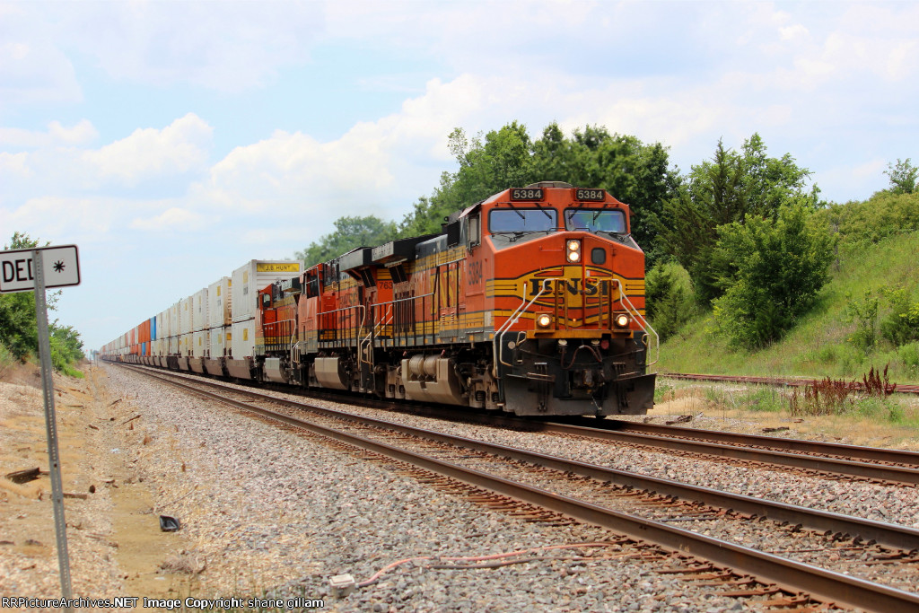BNSF 5384 leads a stretched out EB stack train.